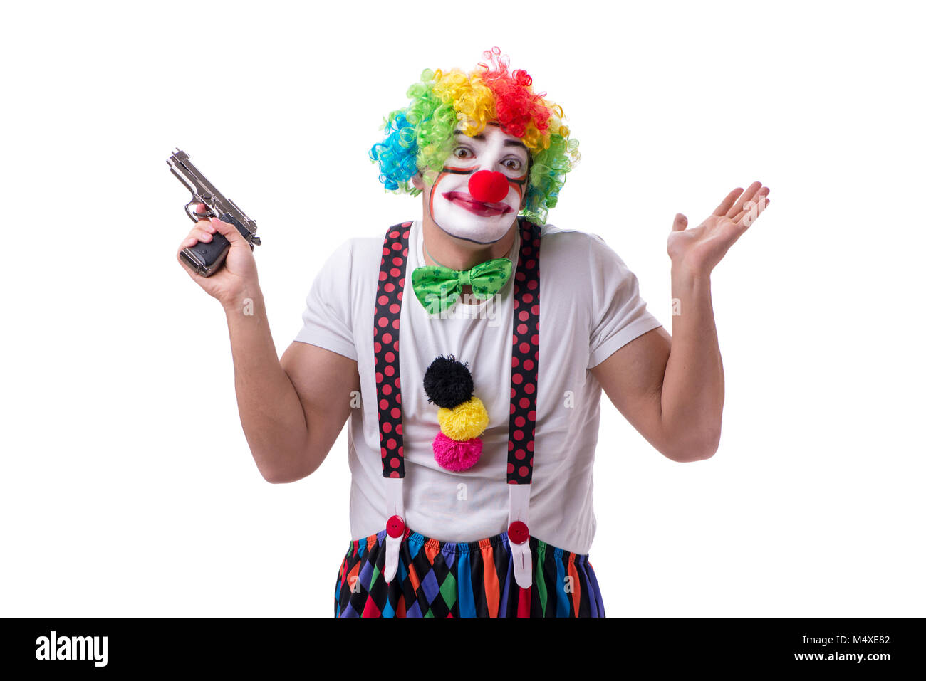 Funny clown with a gun pistol isolated on white background Stock Photo ...