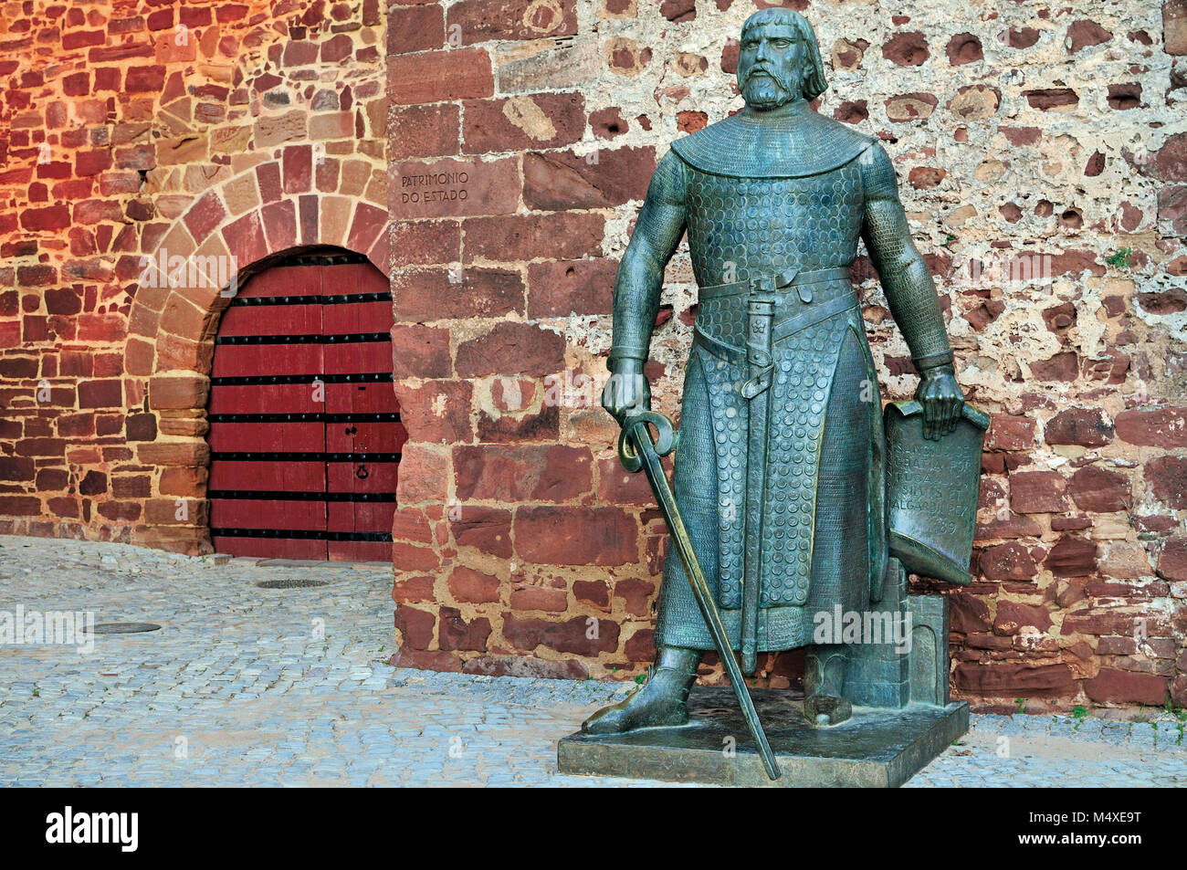 Warrior´s statue of King Dom Sancho 1st at the entrance of the medieval ...