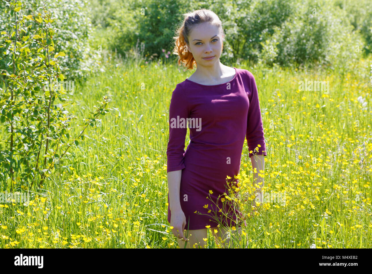 Girl smelling a flower hi-res stock photography and images - Alamy