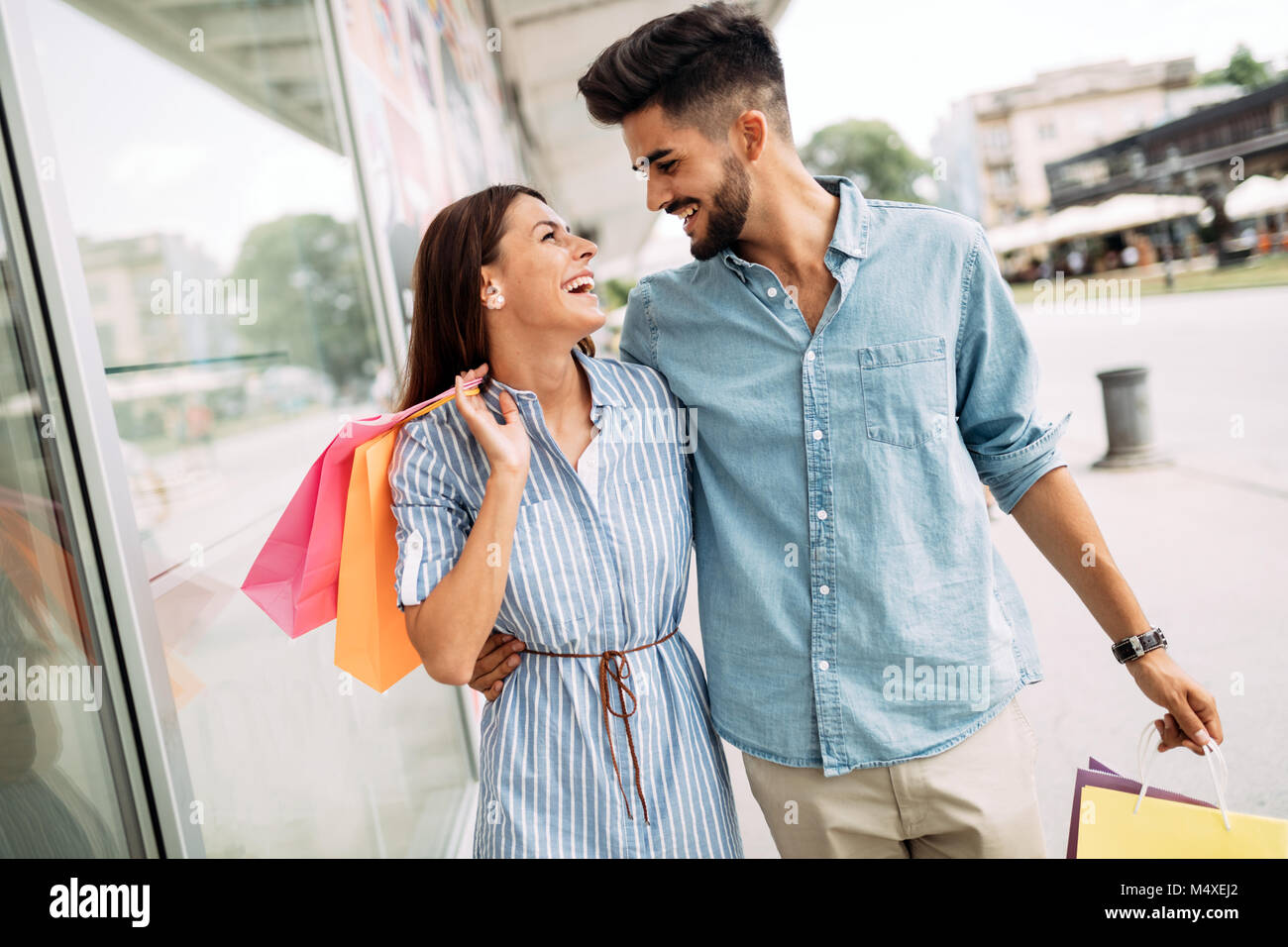 Happy attractive loving couple enjoy shopping together Stock Photo - Alamy