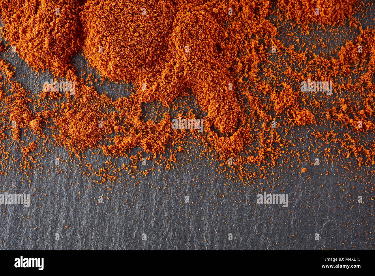 Top view on the texture background of red chilli pepper powder Stock ...