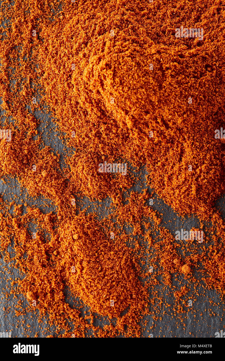 Top view on the texture background of red chilli pepper powder Stock ...