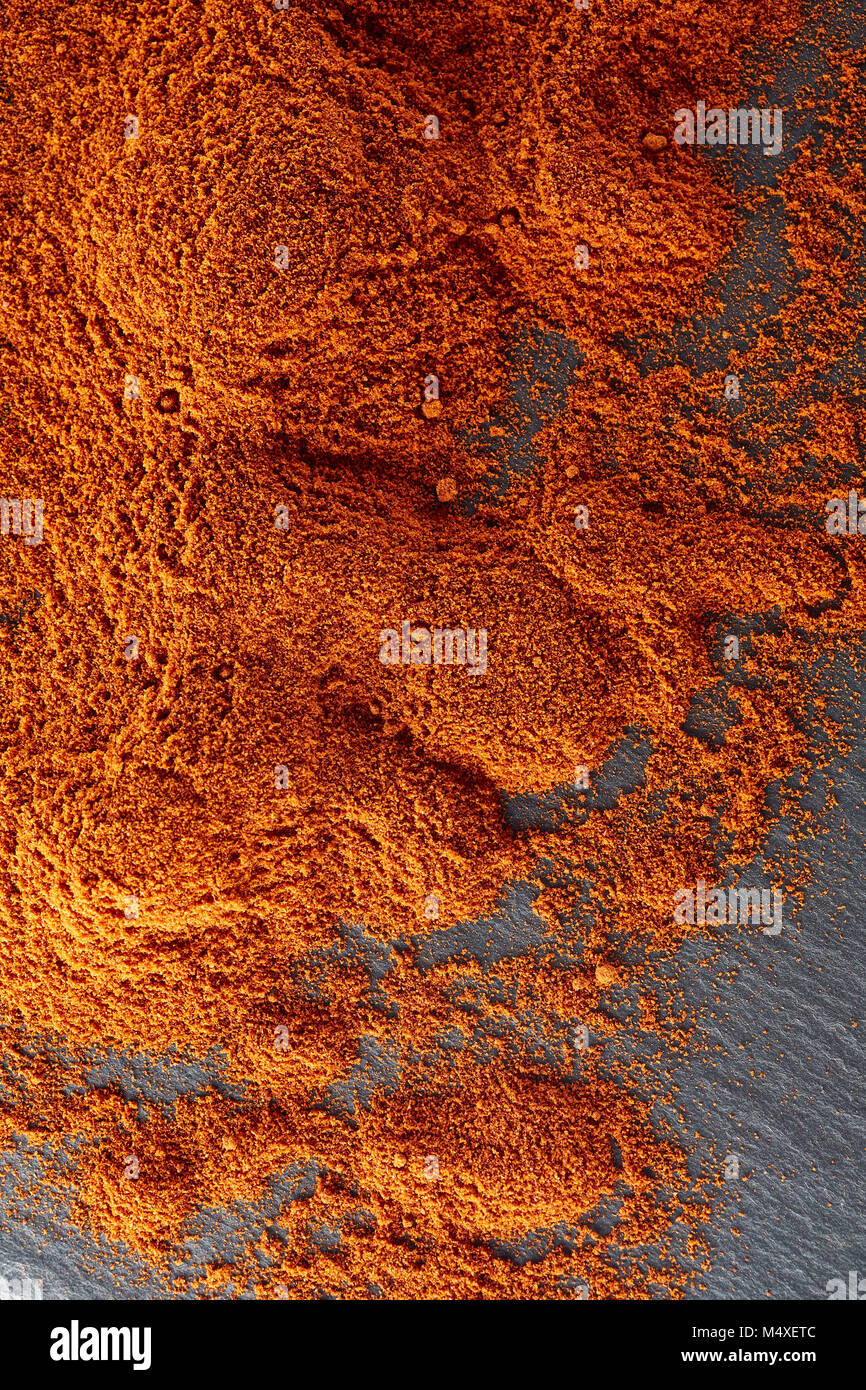 Top view on the texture background of red chilli pepper powder Stock ...