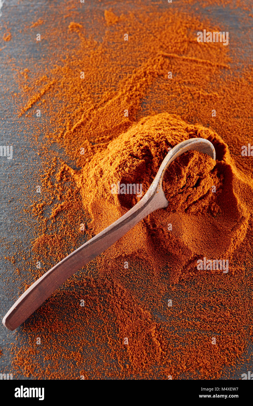 Top view on the texture background of red chilli pepper powder mixed ...