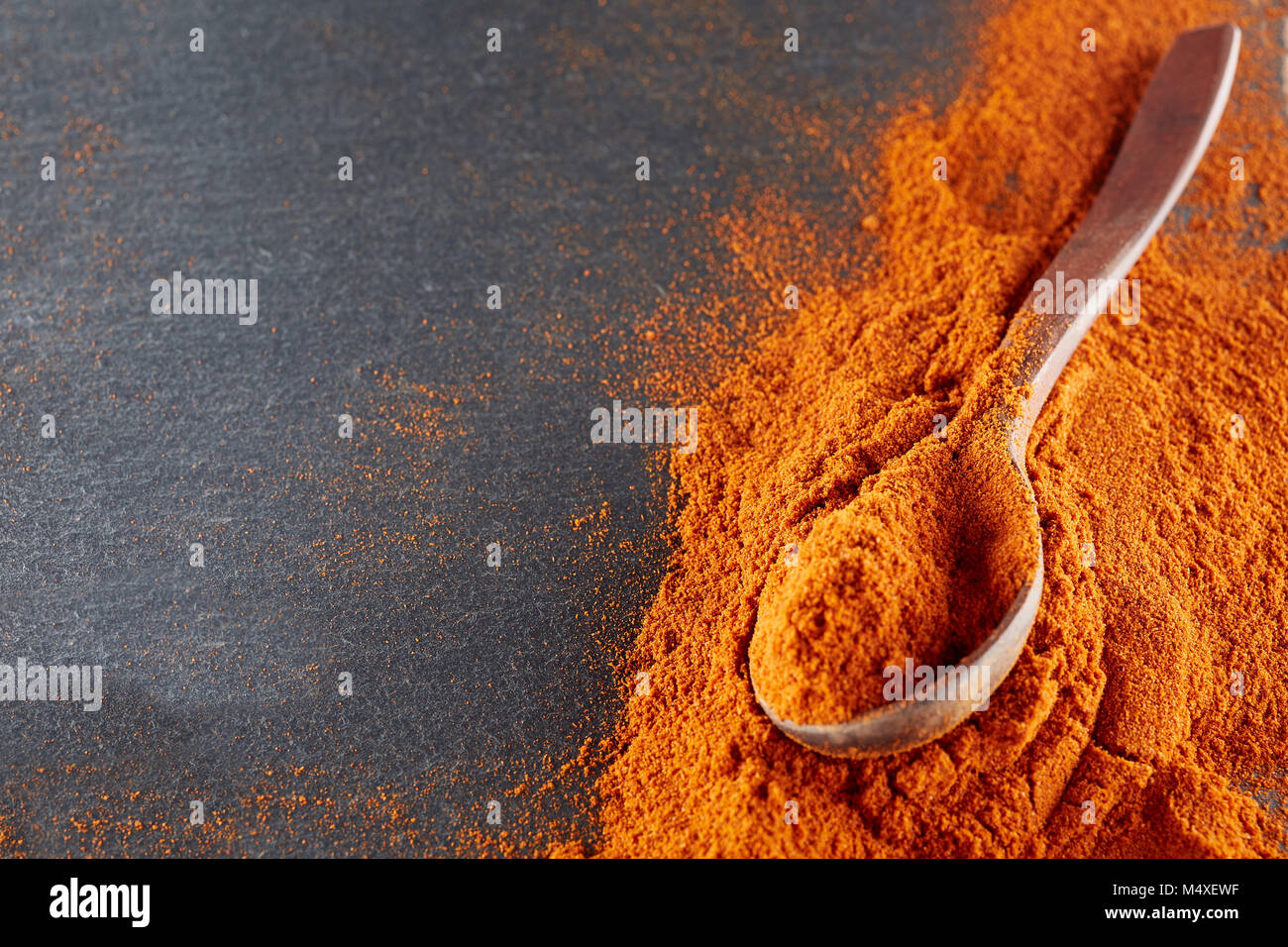 Top view on the texture background of red chilli pepper powder mixed ...