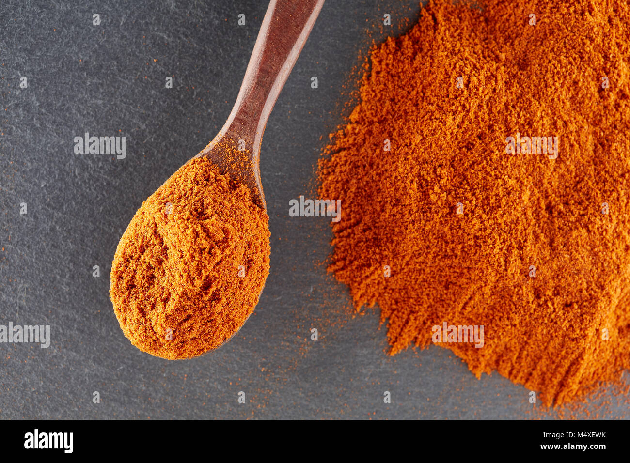 Top view on the texture background of red chilli pepper powder mixed ...