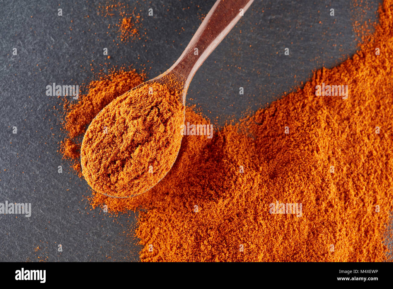 Top view on the texture background of red chilli pepper powder mixed ...