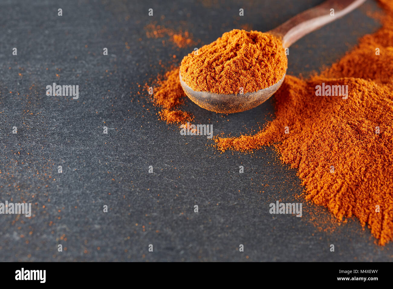 Top view on the texture background of red chilli pepper powder mixed ...