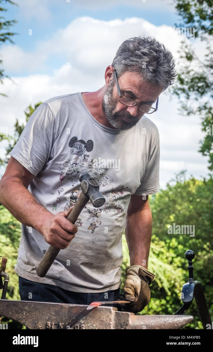Blacksmith at work Stock Photo - Alamy