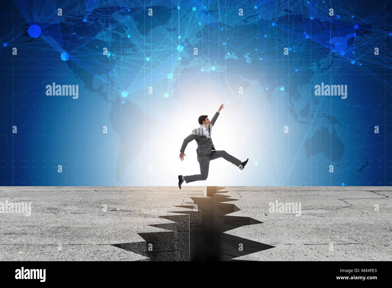 Businessman jumping over the cliff Stock Photo - Alamy