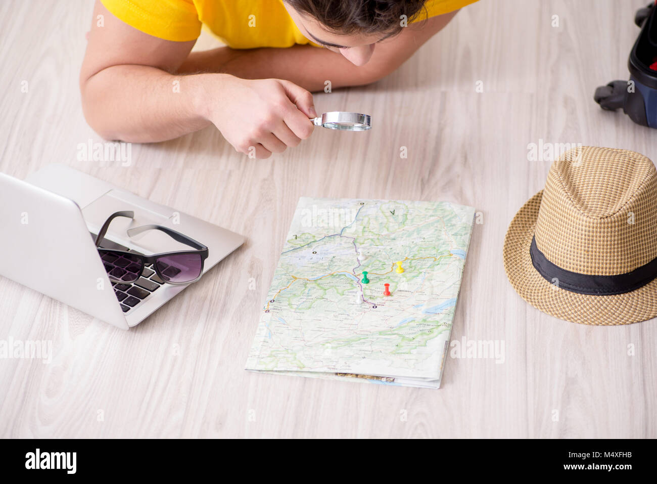 Man planning his vacation trip with map Stock Photo - Alamy