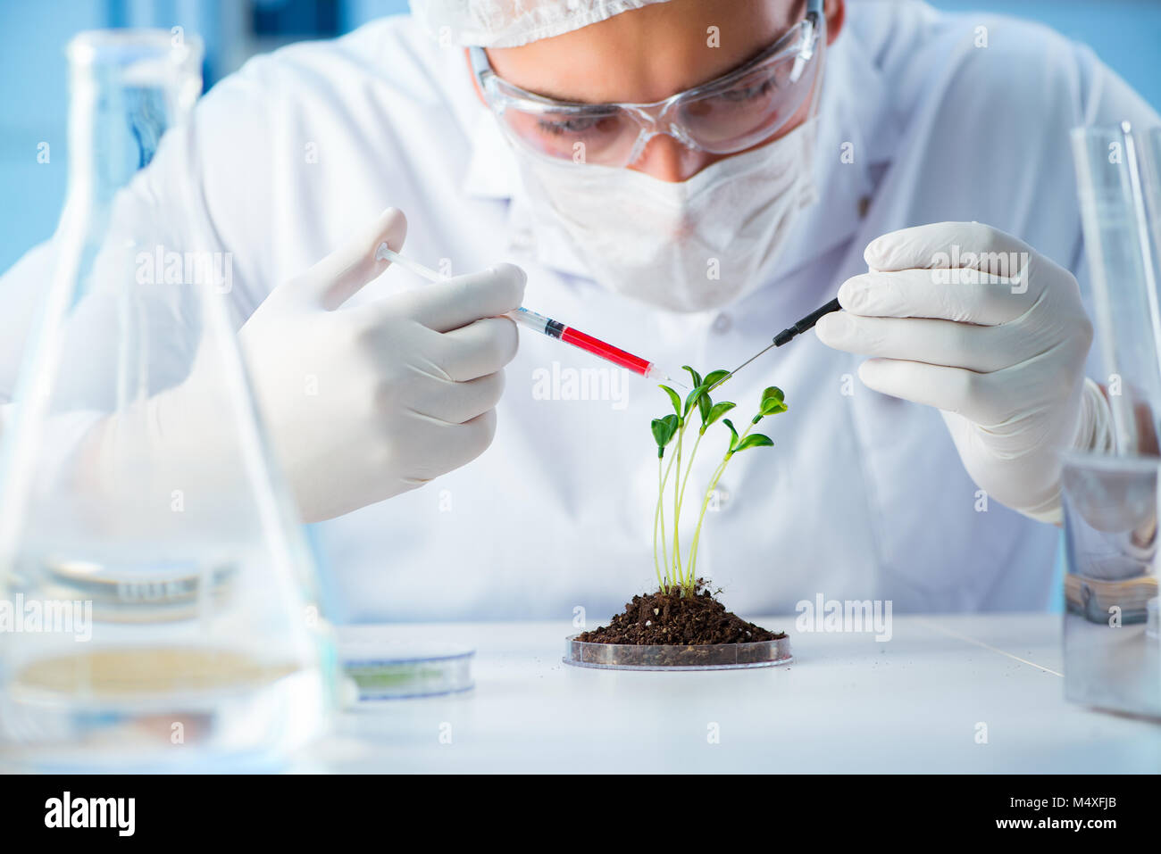 Biotechnology concept with scientist in lab Stock Photo - Alamy