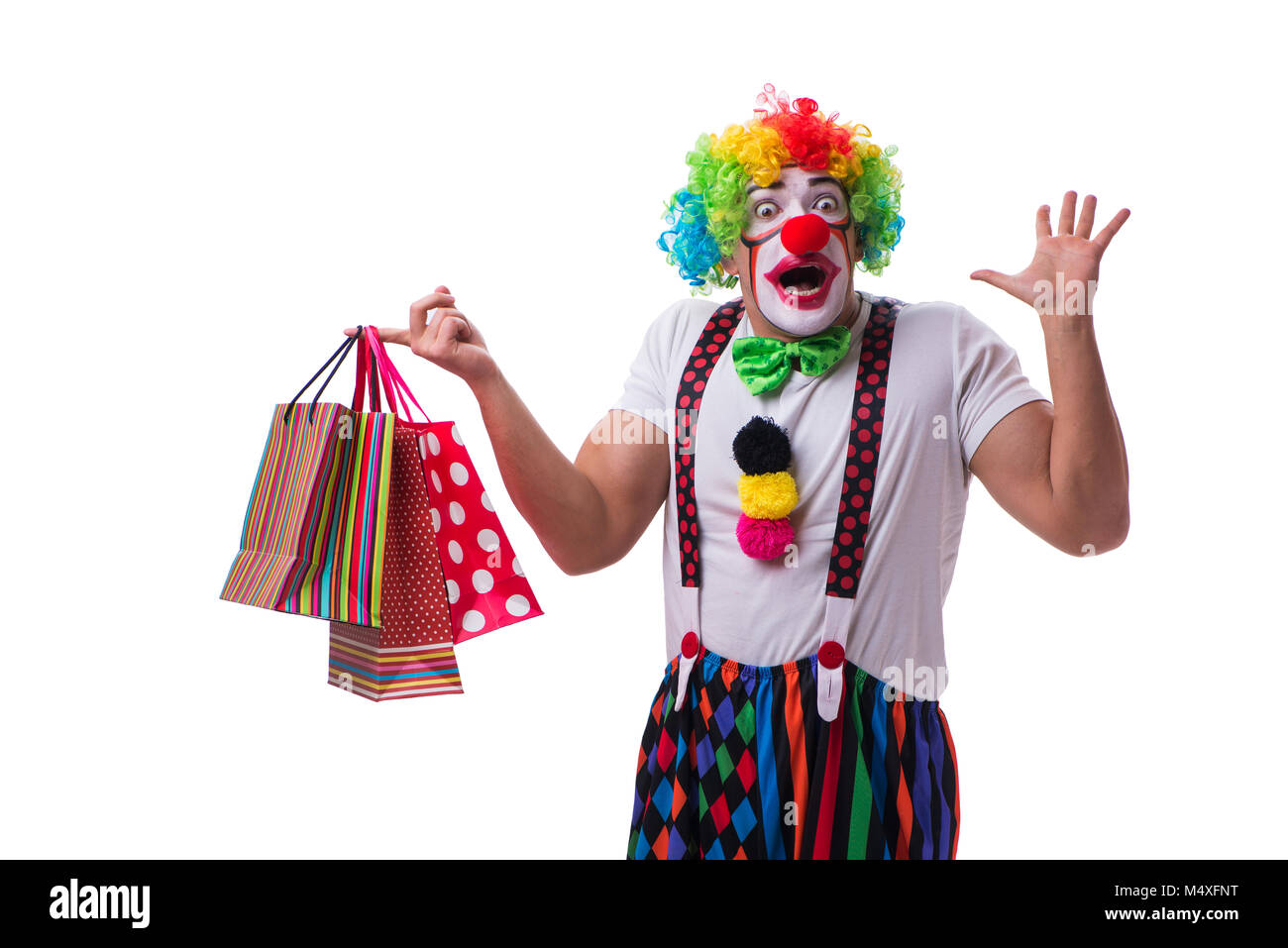 Funny clown with shopping bags isolated on white background Stock Photo ...