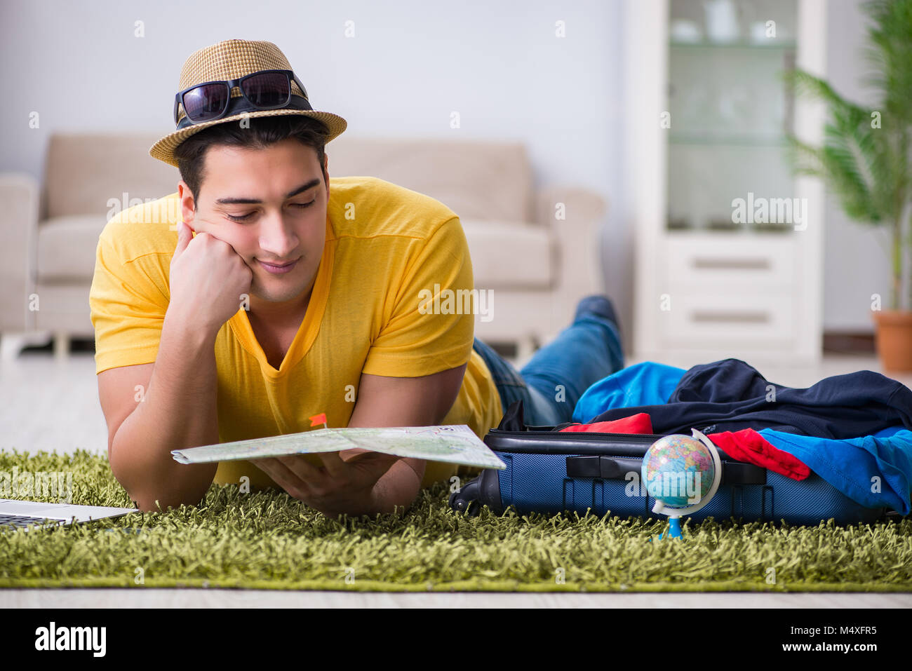 Man planning his vacation trip with map Stock Photo - Alamy