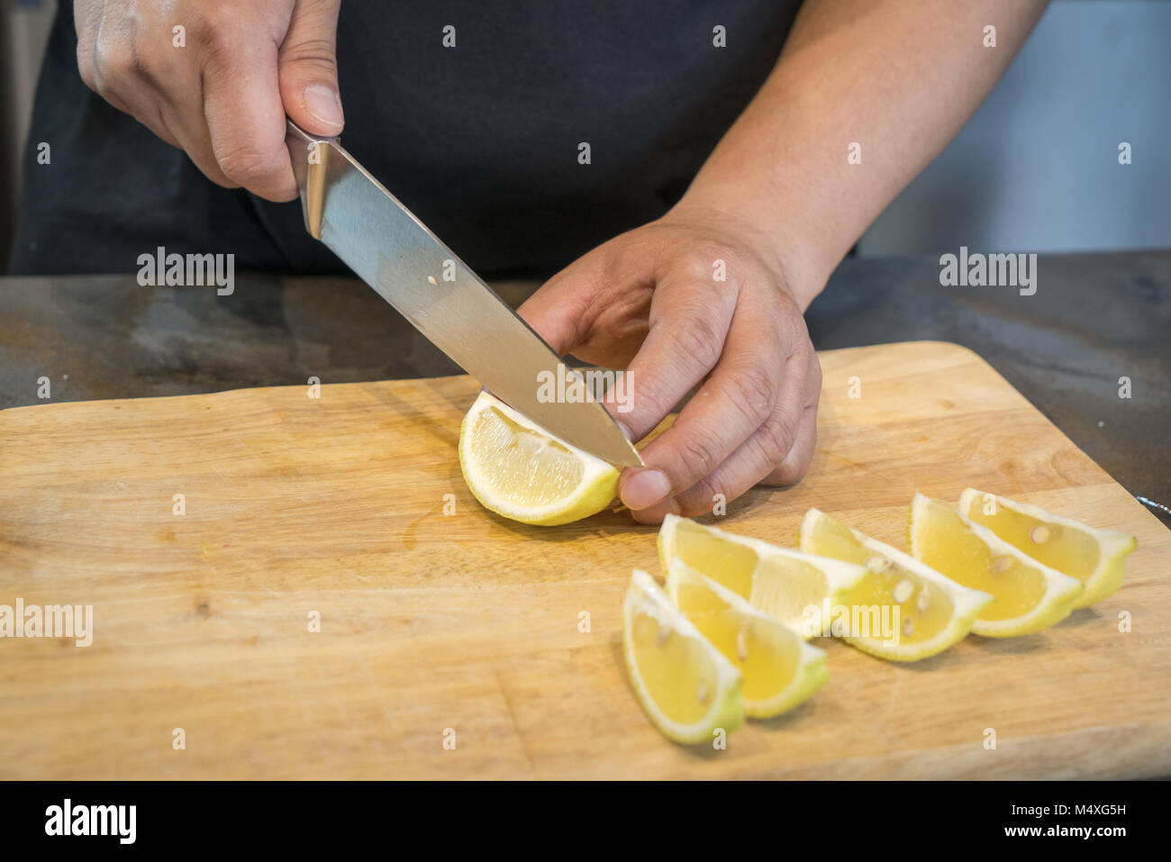 Female cutting lime on board hi-res stock photography and images - Alamy