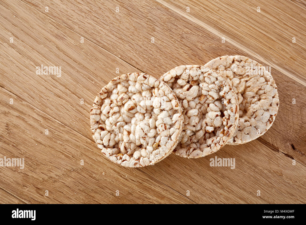 Stack of buckwheat crispbreads on light wooden table Stock Photo - Alamy