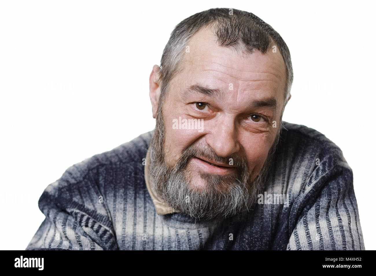 Real man with a beard looks at the camera on white background smiles ...