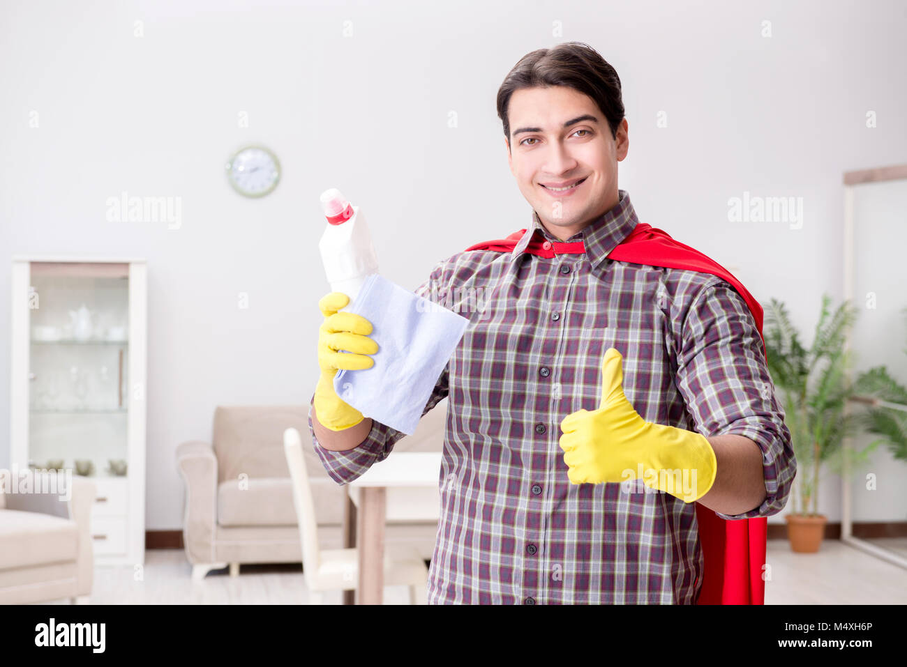 The super hero cleaner doing housework Stock Photo - Alamy