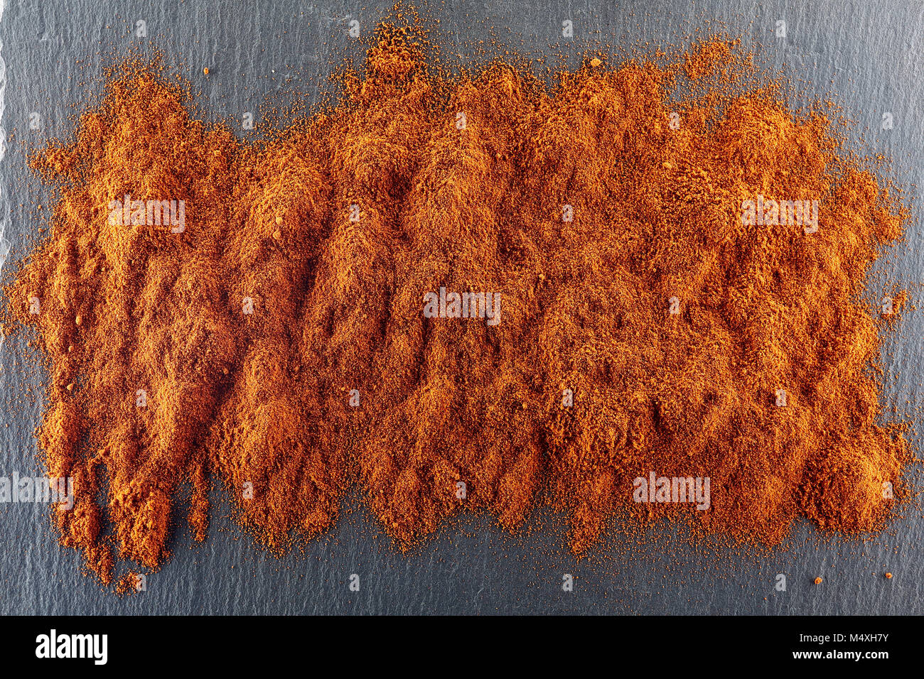 Top view on the texture background of red chilli pepper powder Stock ...
