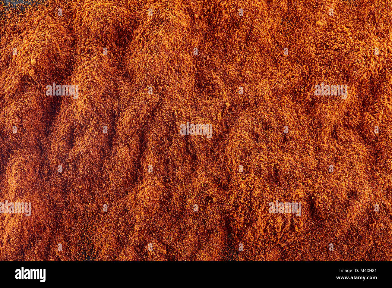 Top view on the texture background of red chilli pepper powder Stock ...