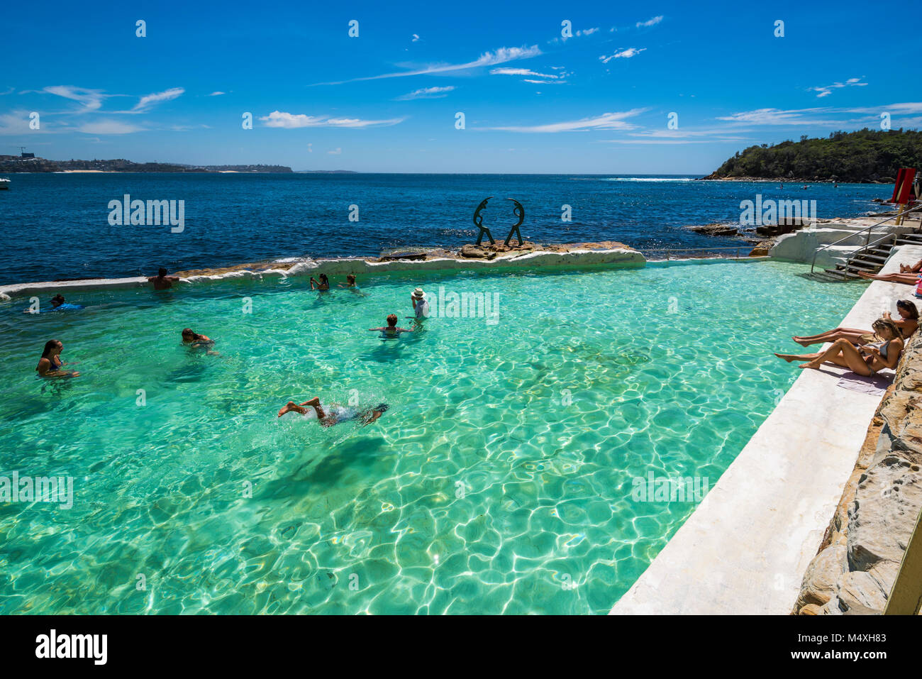Cabbage Tree bay rock pool, Manly on a hot summer day with blue sky ...