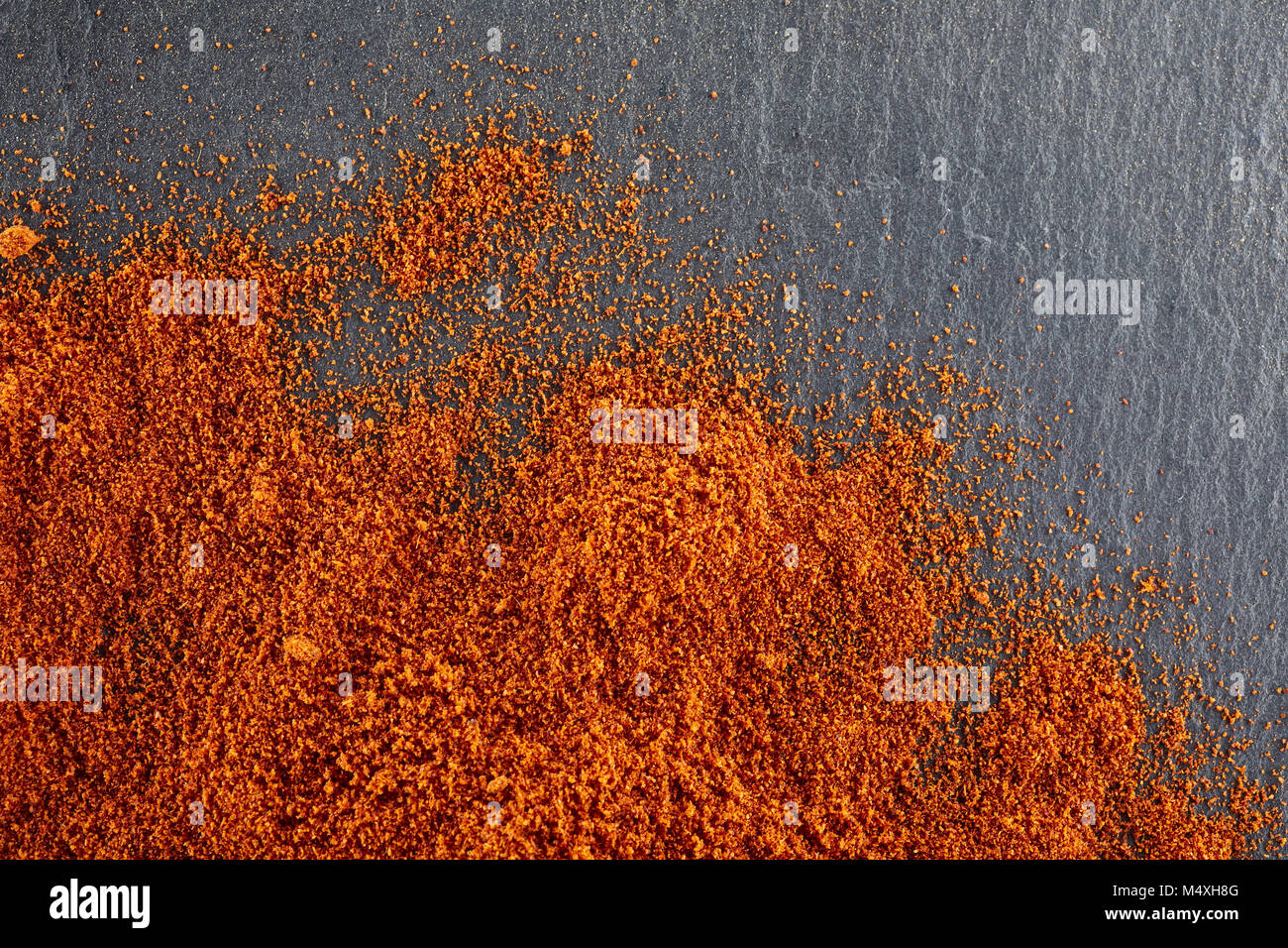 Top view on the texture background of red chilli pepper powder Stock ...