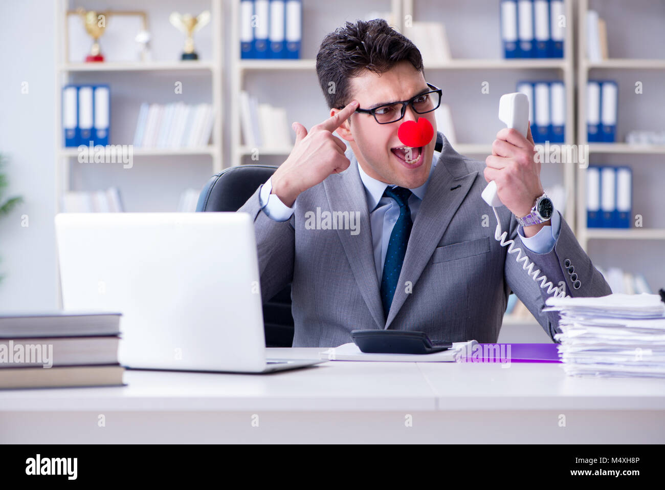 Clown businessman angry frustrated working in the office Stock Photo ...