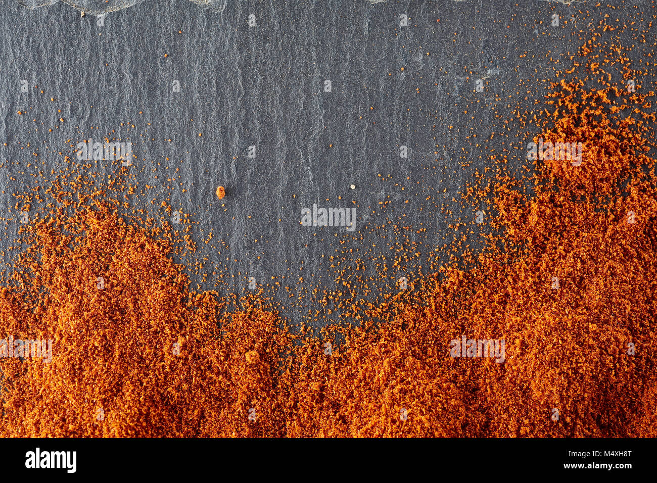 Top view on the texture background of red chilli pepper powder Stock ...