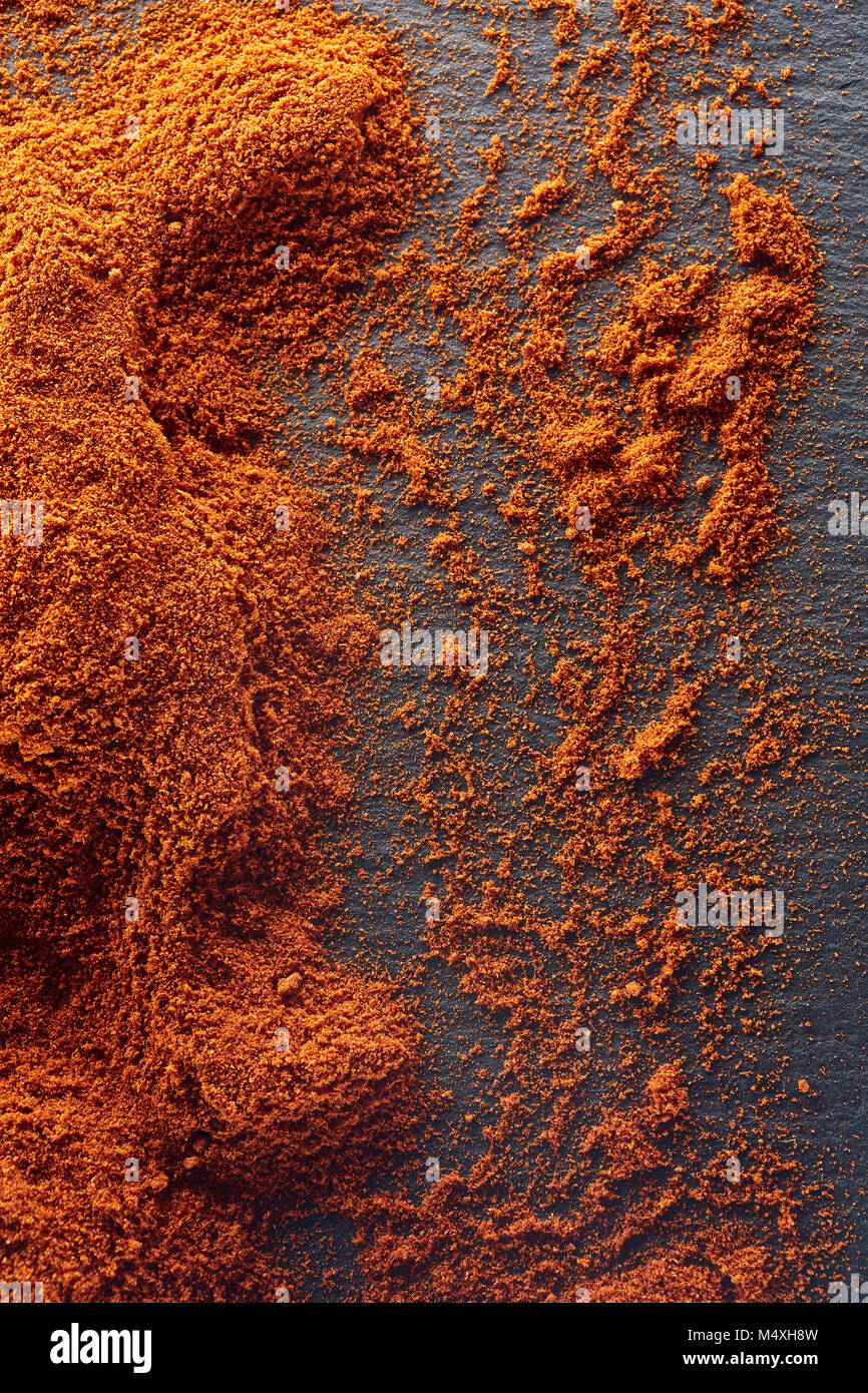Top view on the texture background of red chilli pepper powder Stock ...
