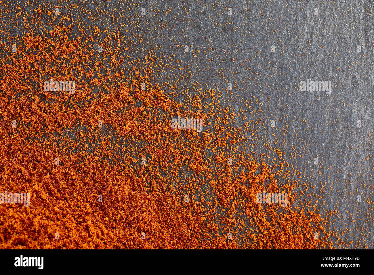 Top view on the texture background of red chilli pepper powder Stock ...