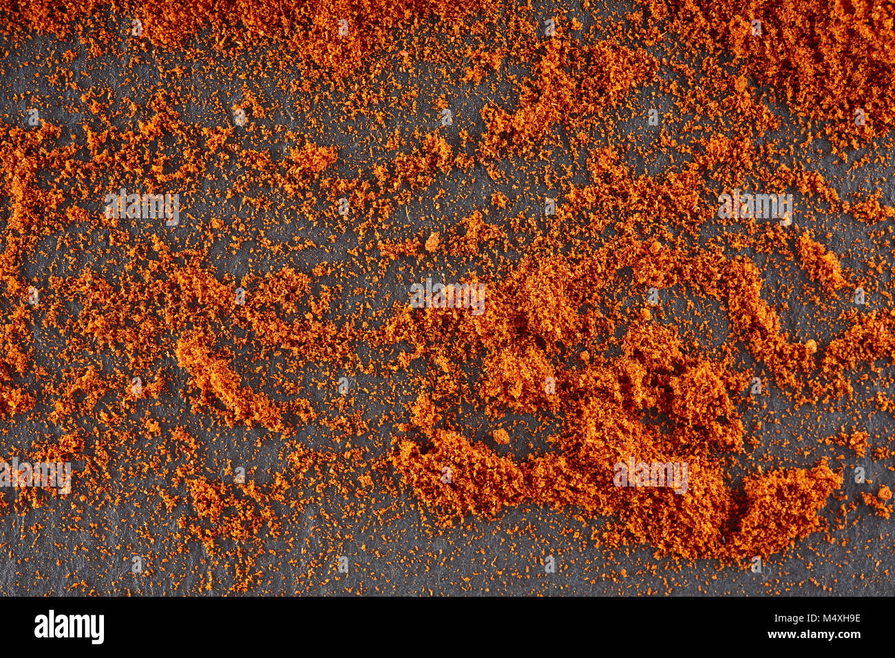 Top view on the texture background of red chilli pepper powder Stock ...