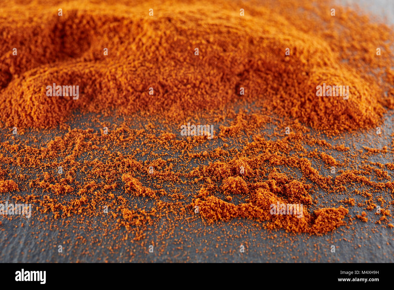 Top view on the texture background of red chilli pepper powder Stock ...