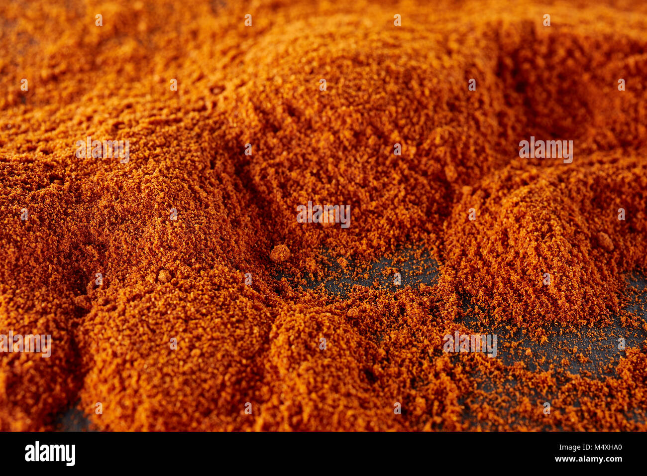 Top view on the texture background of red chilli pepper powder Stock ...