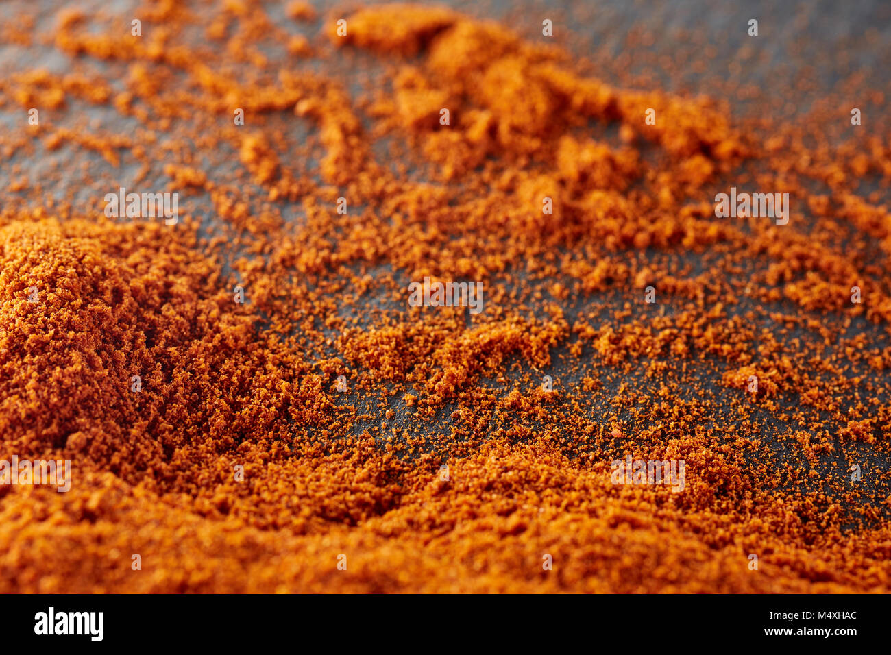 Top view on the texture background of red chilli pepper powder Stock ...