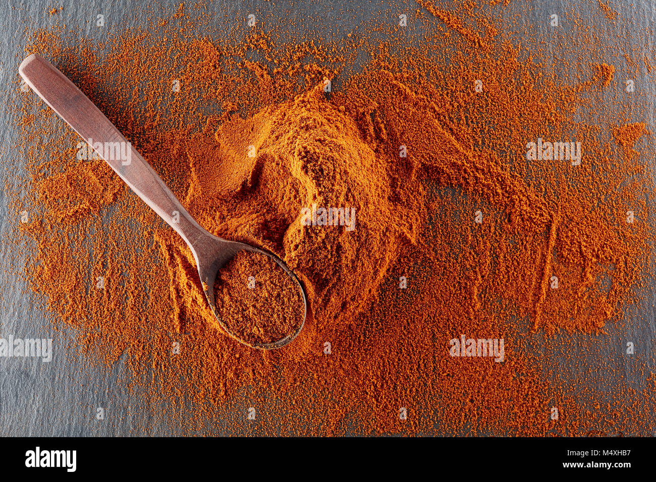 Top view on the texture background of red chilli pepper powder mixed ...