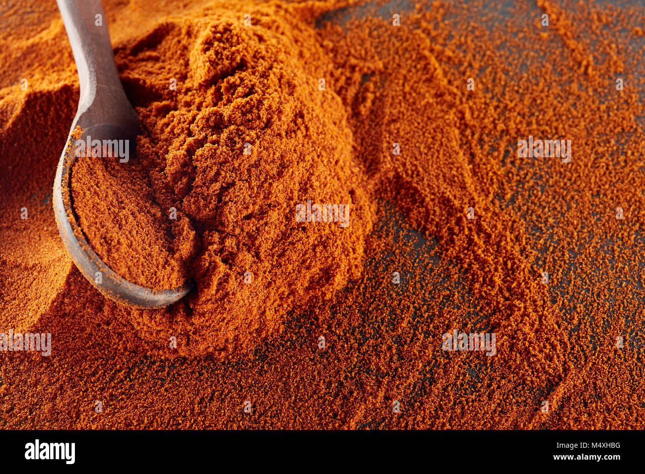 Top view on the texture background of red chilli pepper powder mixed ...