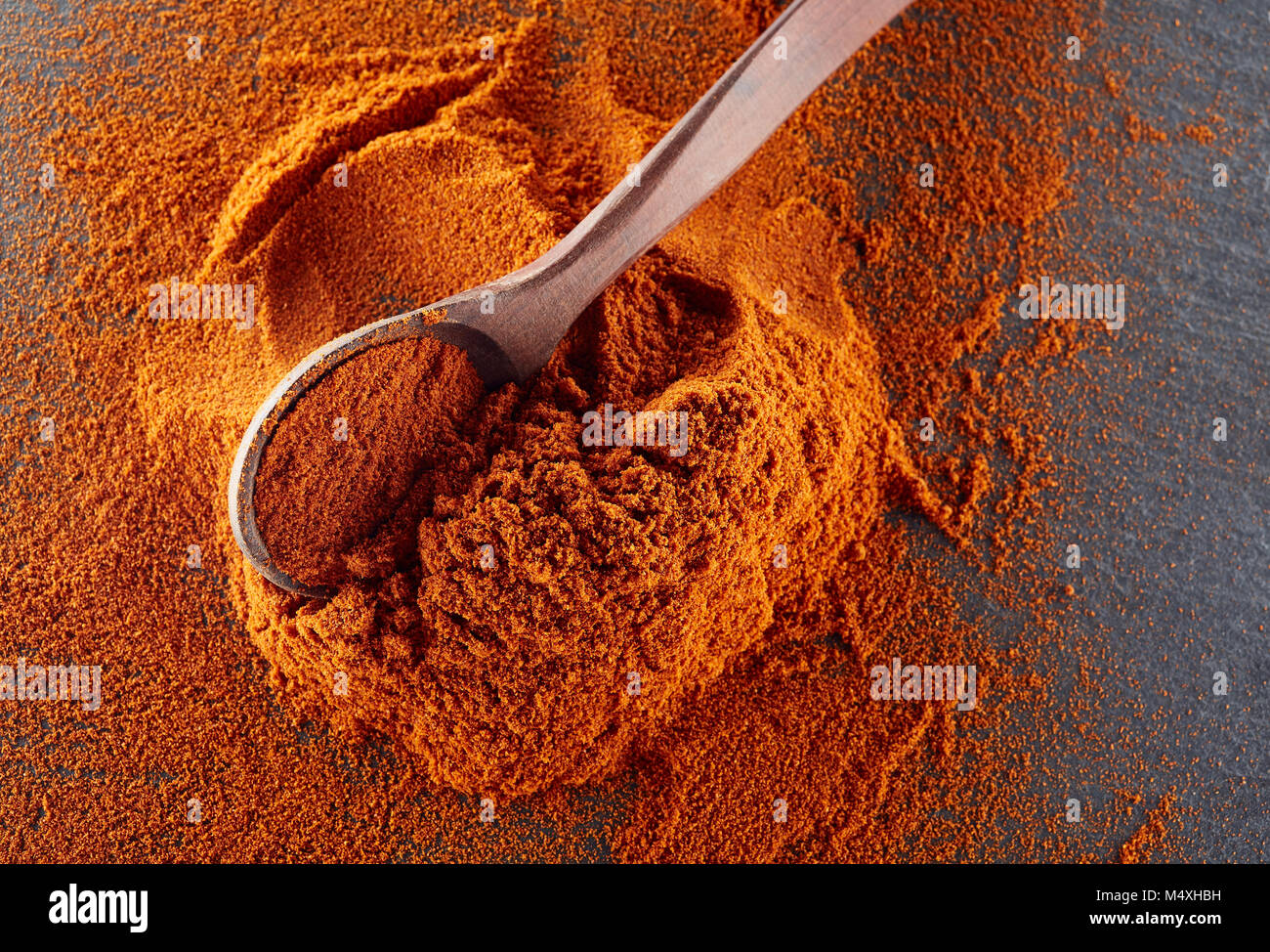 Top view on the texture background of red chilli pepper powder mixed ...