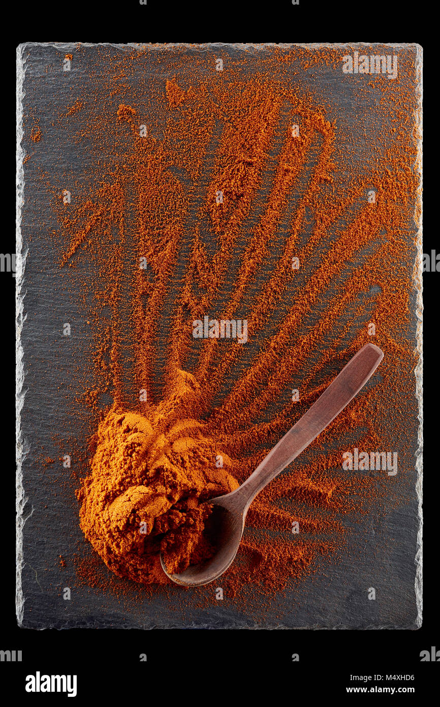 Top view on the texture background of red chilli pepper powder mixed ...