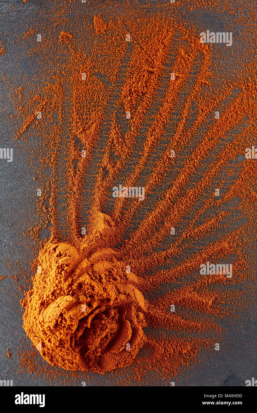 Top view on the texture background of red chilli pepper powder mixed ...