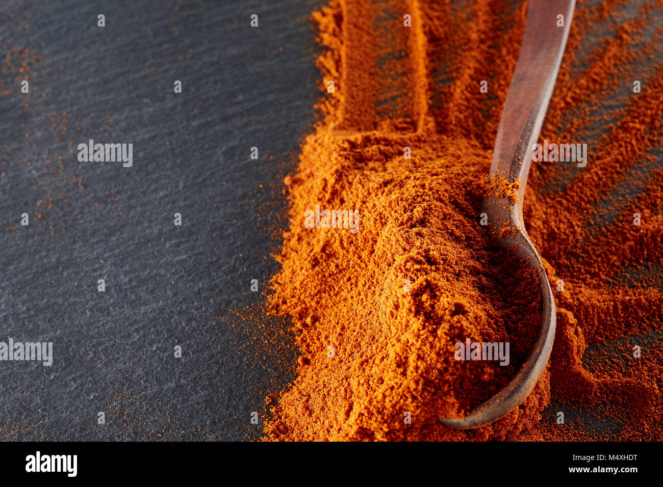 Top view on the texture background of red chilli pepper powder mixed ...