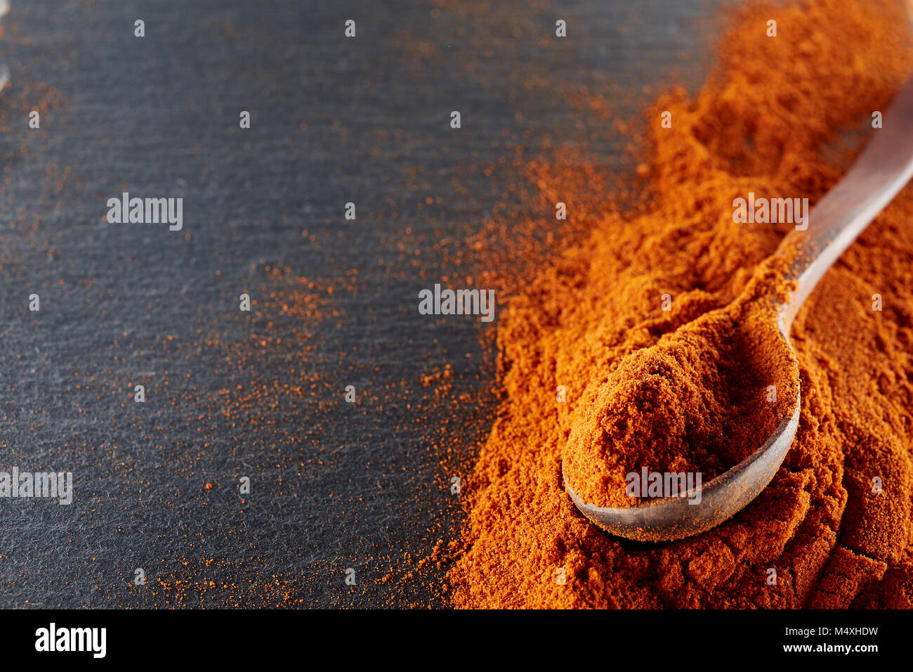 Top view on the texture background of red chilli pepper powder mixed ...