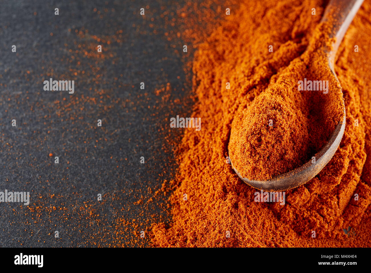 Top view on the texture background of red chilli pepper powder mixed ...
