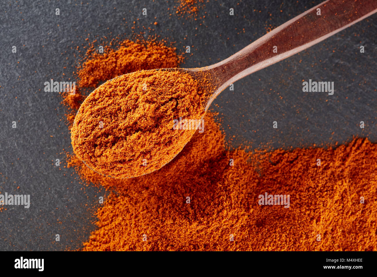 Top view on the texture background of red chilli pepper powder mixed ...