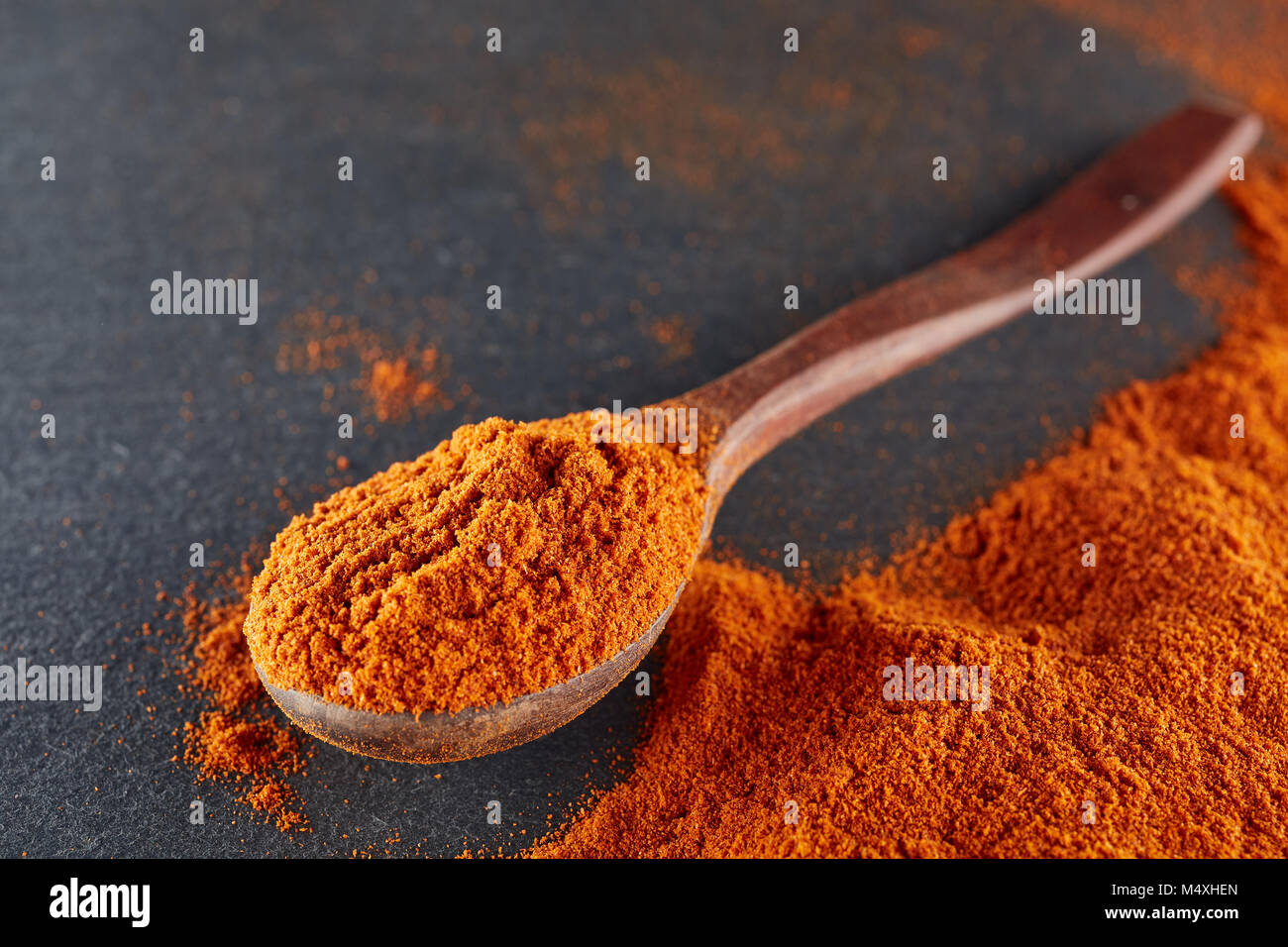 Top view on the texture background of red chilli pepper powder mixed ...