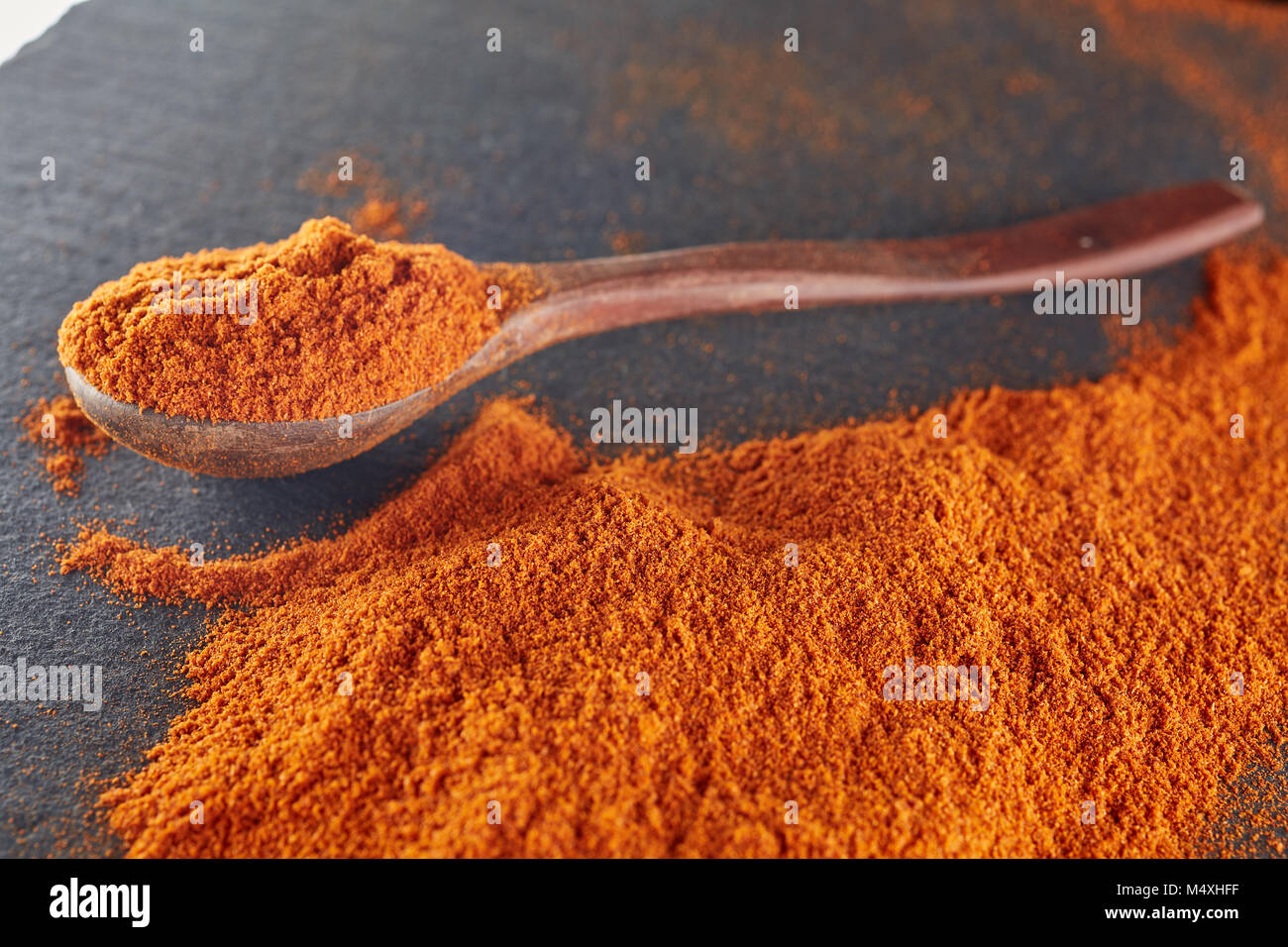 Top view on the texture background of red chilli pepper powder mixed ...