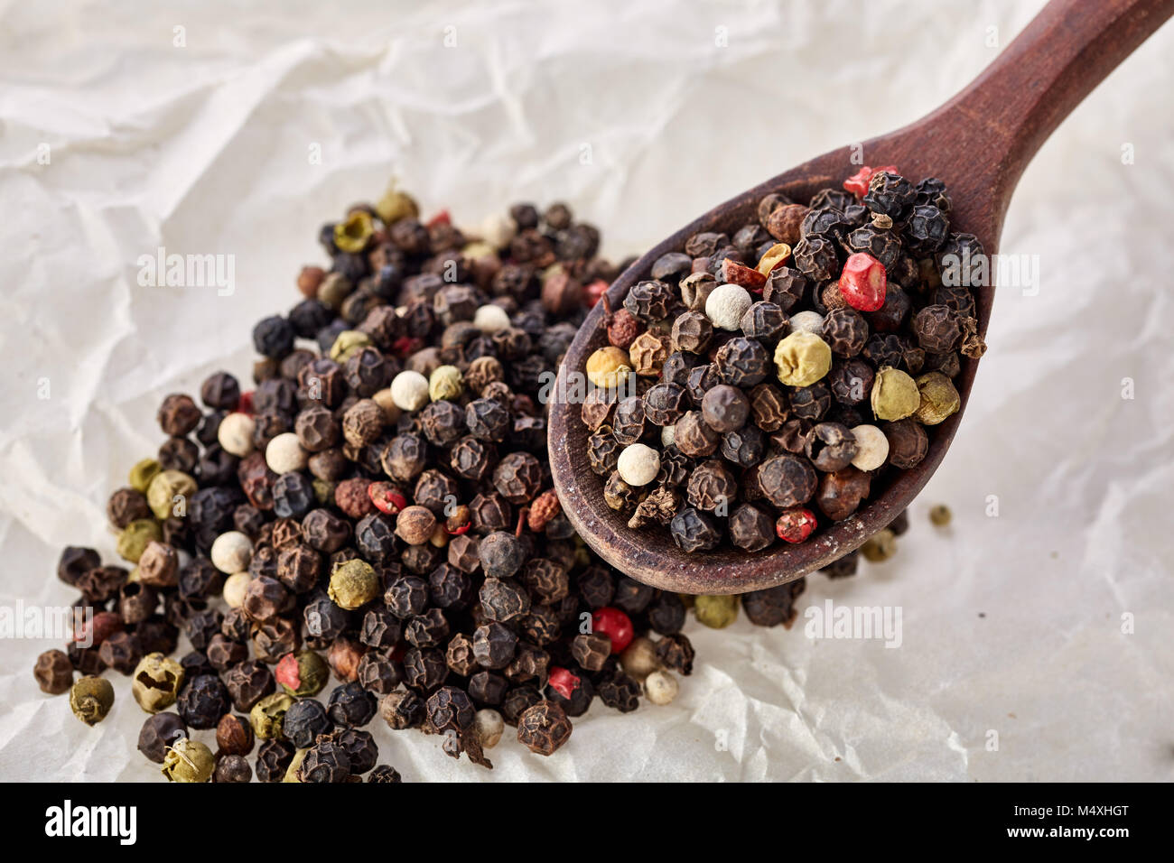 Shichimi pepper in Wooden spoon on crumpled paper background,Blend of ...