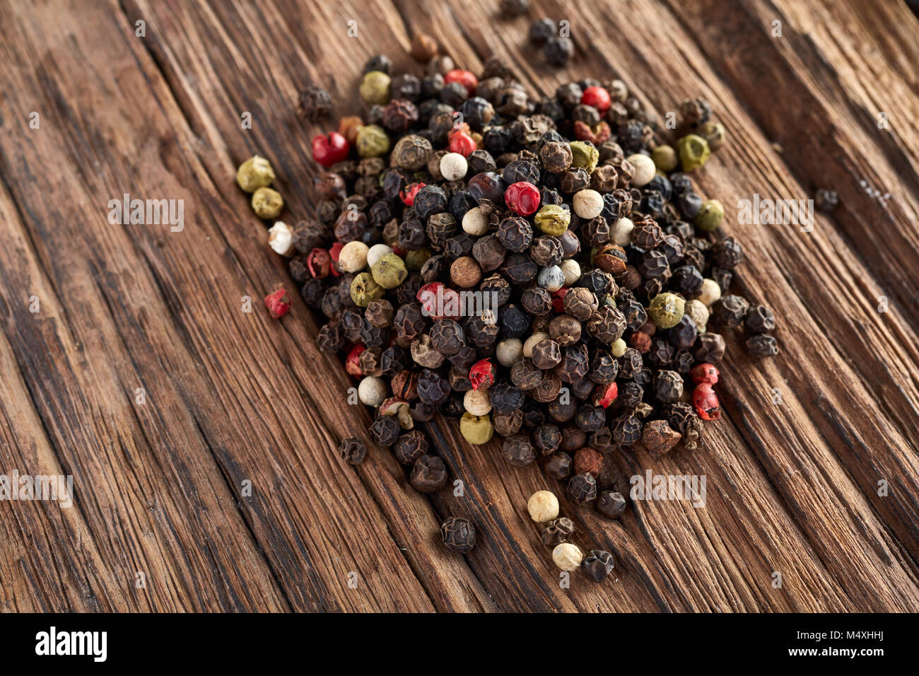 Mixed peppercorns. Dry mix peppercorns close up Stock Photo - Alamy