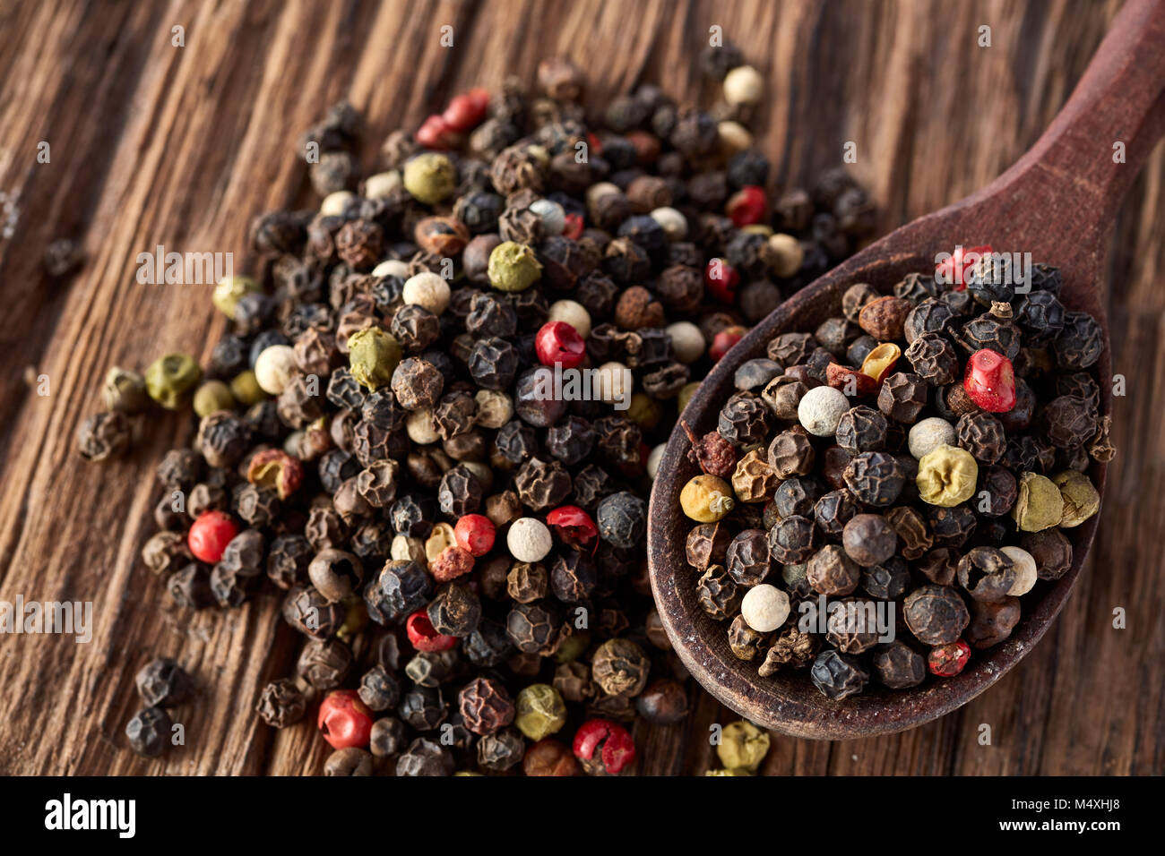 Mixed peppercorns. Dry mix peppercorns close up Stock Photo - Alamy