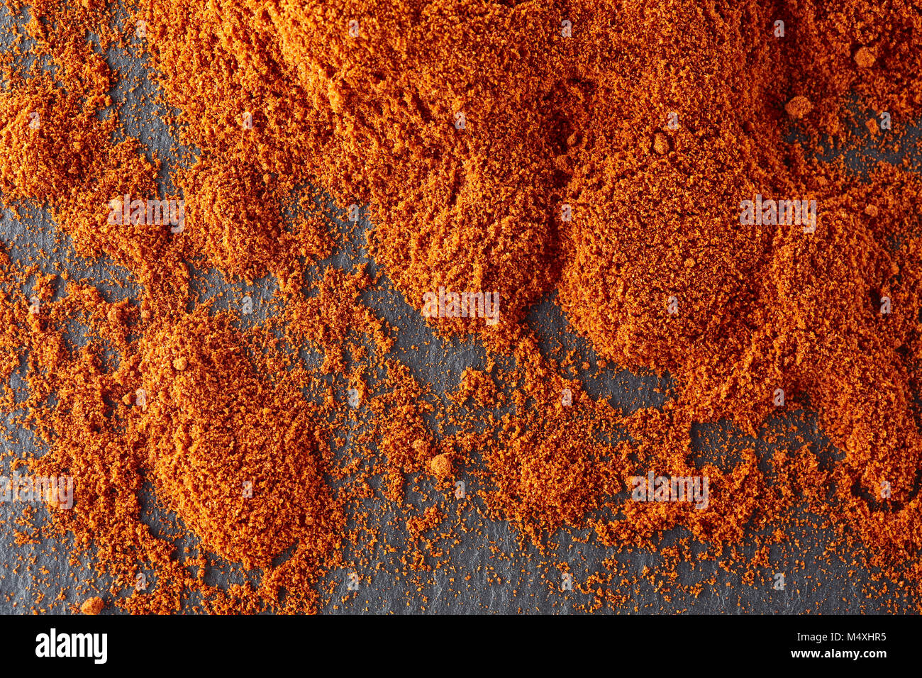 Top view on the texture background of red chilli pepper powder Stock ...