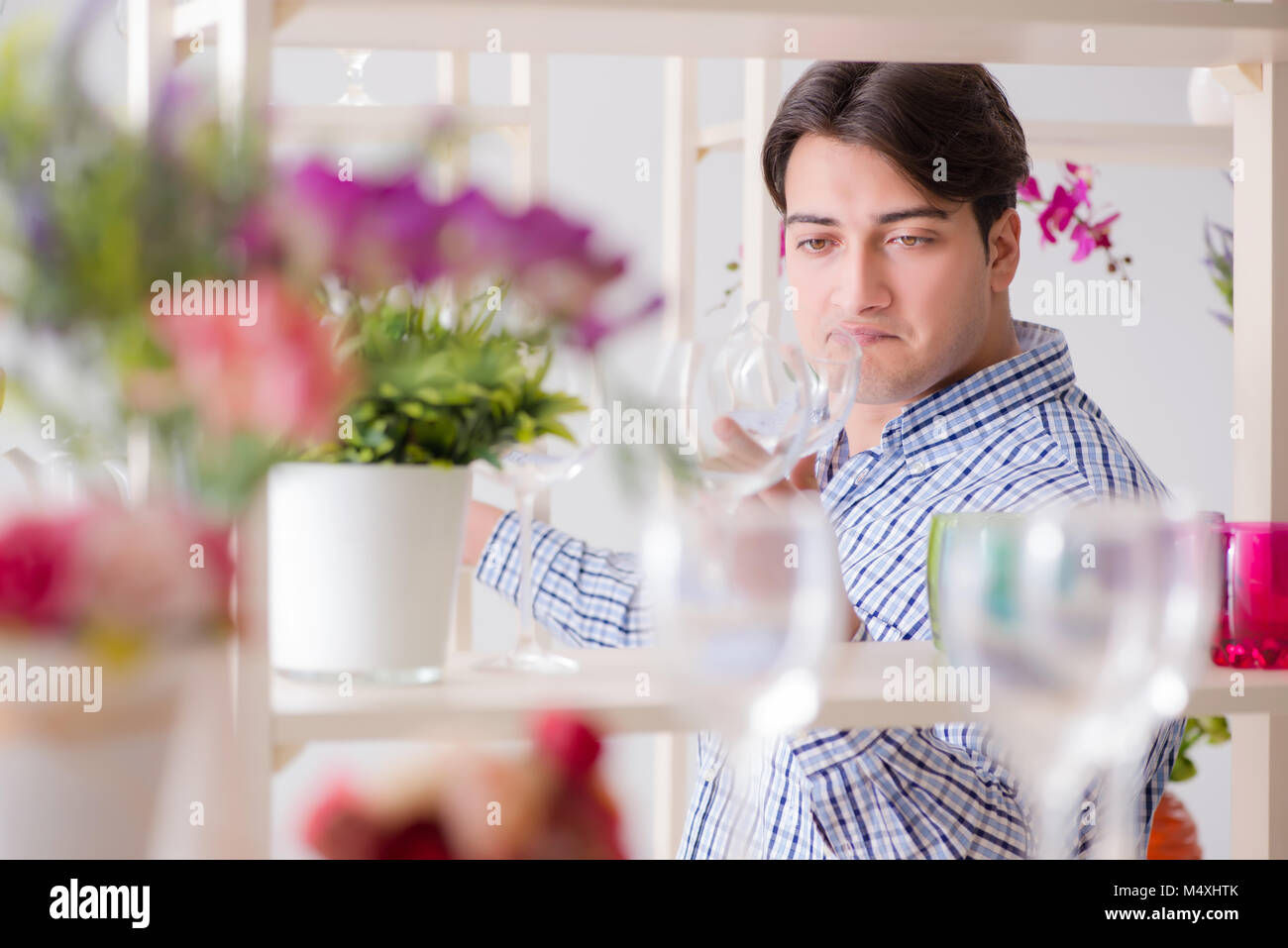 Young handsome man shopping in shop Stock Photo - Alamy